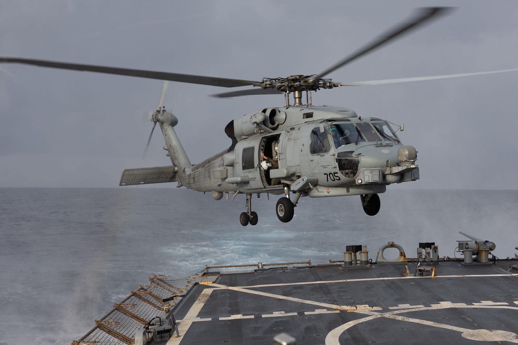 A helicopter and a U.S. Navy fighter jet crashed in the South China Sea ...
